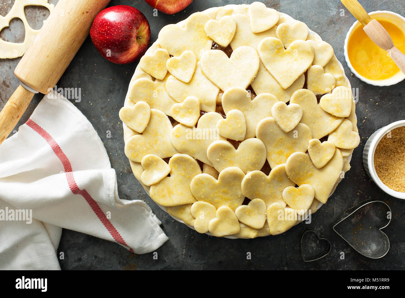 Making apple pie from scratch with heart shaped crust Stock Photo - Alamy