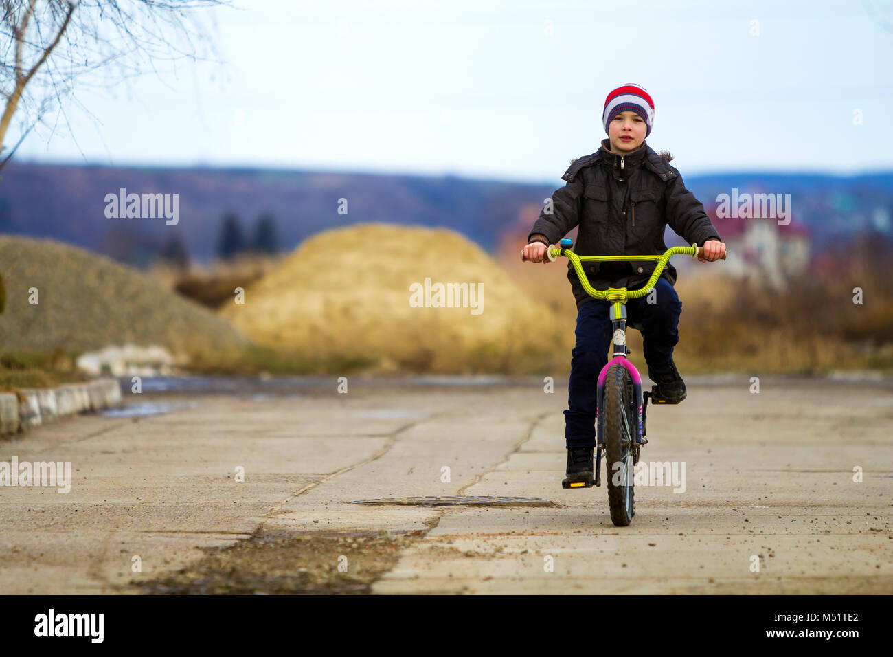 Little boy riding his bicycle in park outdoors Stock Photo - Alamy