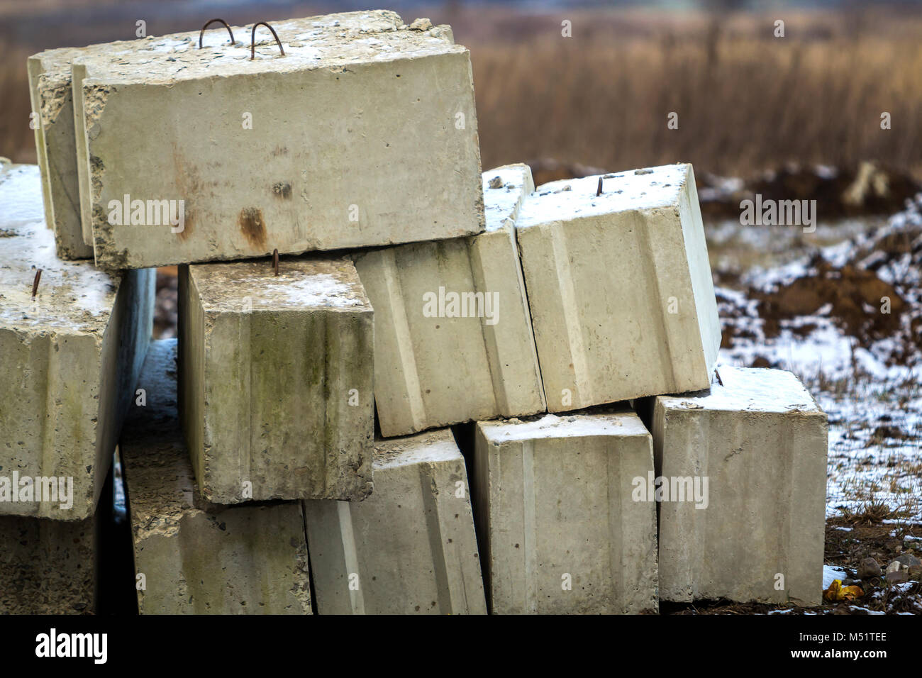 Stack of concrete blocks for foundation on construction site ...