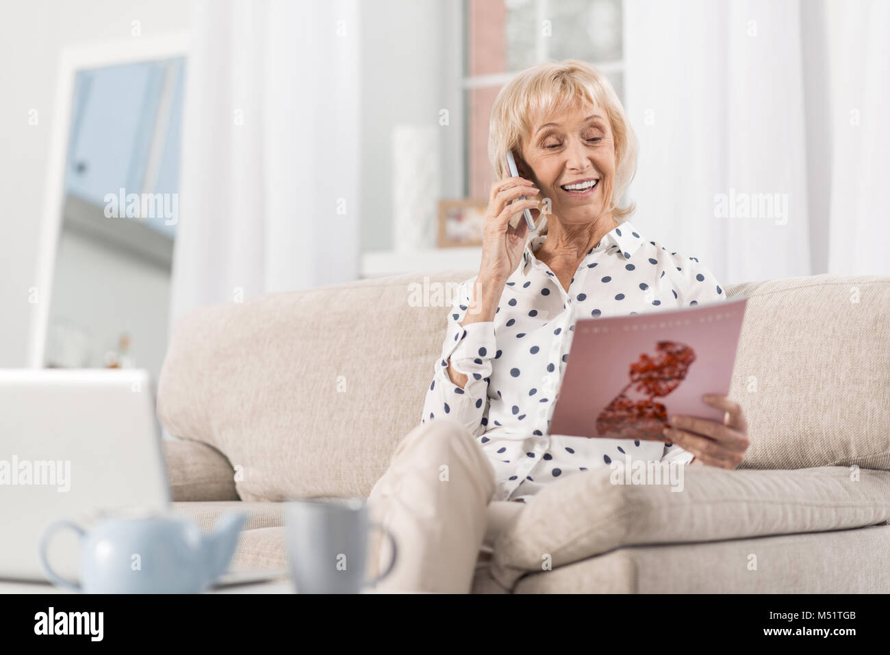 Nice mature woman making call Stock Photo - Alamy