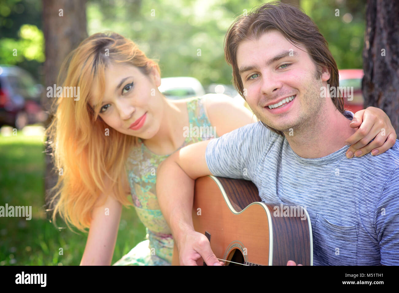 Sweet couple in love in the park Stock Photo - Alamy