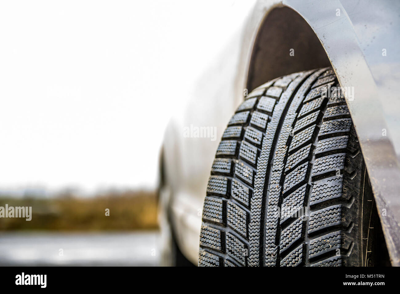 Close-up image of car wheel with black rubber tire Stock Photo - Alamy