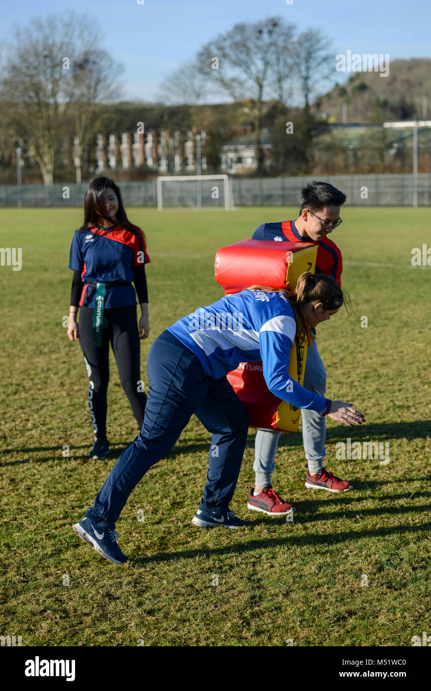 A school PE lesson where the teacher is teaching the college students ...