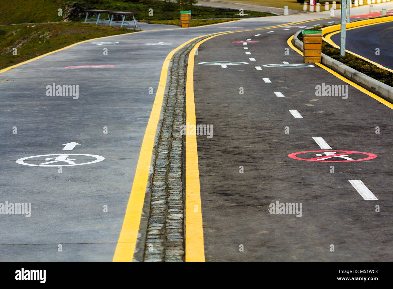 Walk way and bicycle lane signs on the asphalt road surface Stock Photo ...
