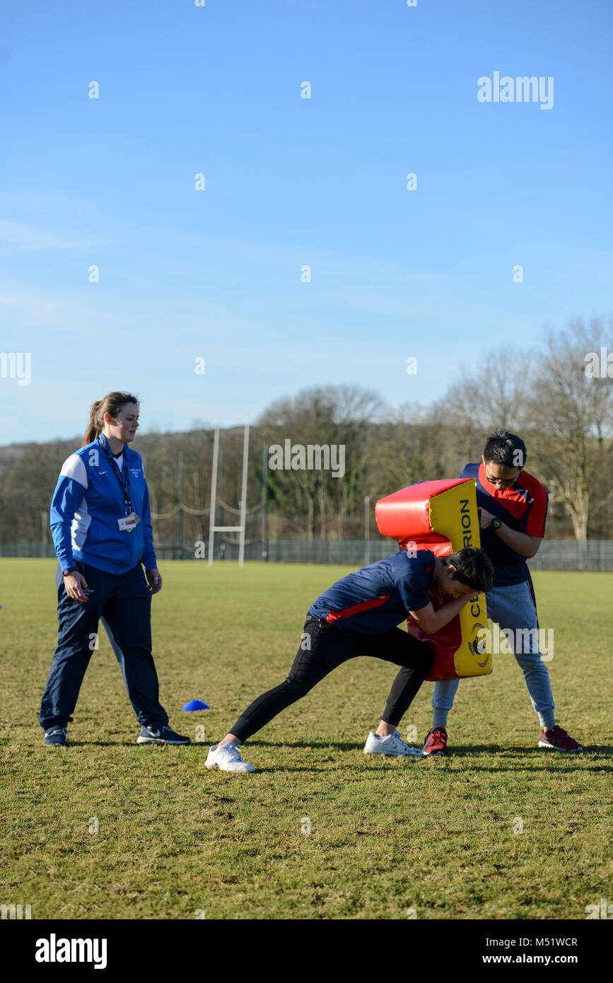 A school PE lesson where the teacher is teaching the college students ...