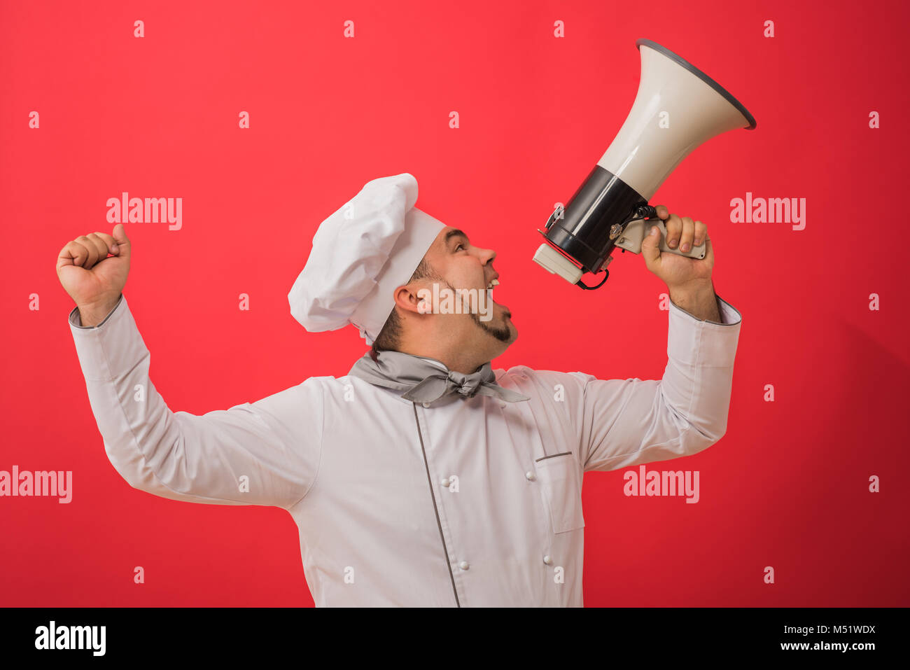 Portrait of caucasian man with chef uniform holding megaphone Stock ...