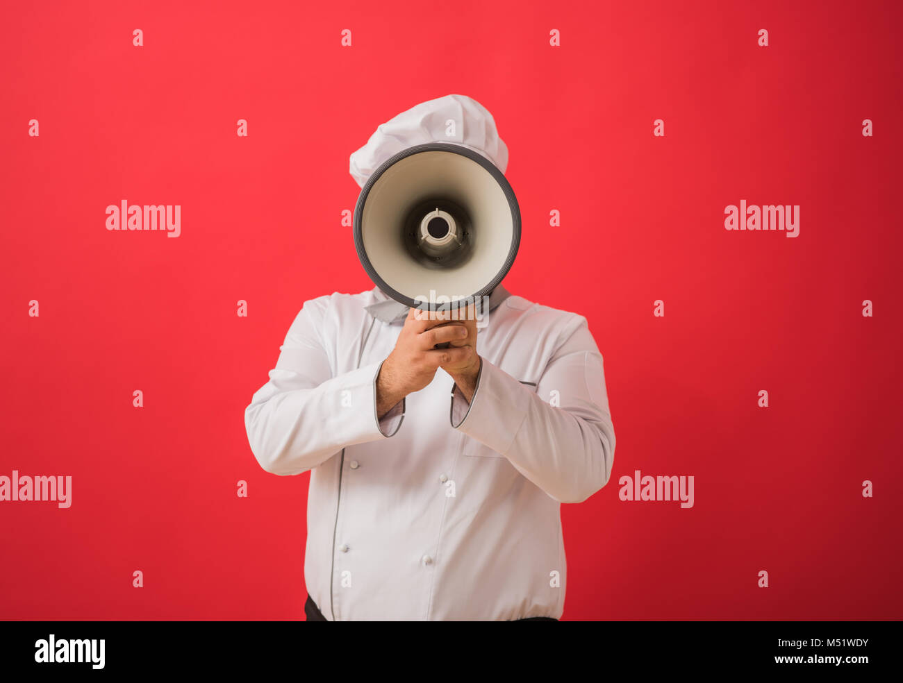 Portrait of caucasian man with chef uniform holding megaphone Stock ...