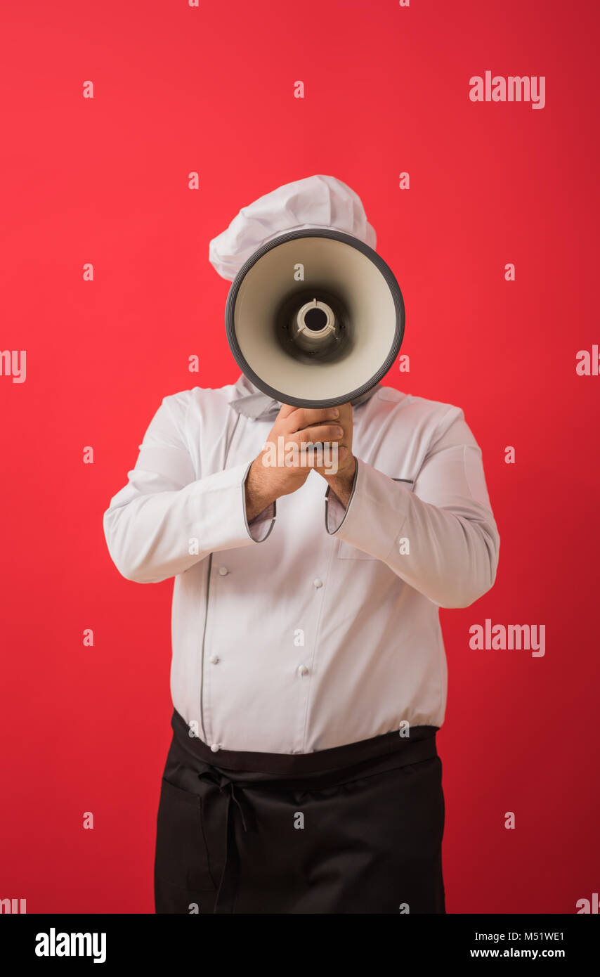 Portrait of caucasian man with chef uniform holding megaphone Stock ...
