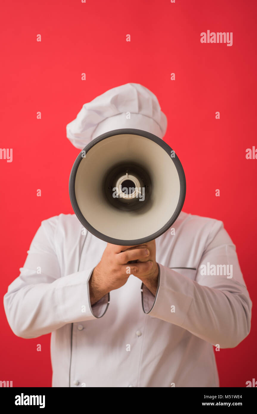 Portrait of caucasian man with chef uniform holding megaphone Stock ...