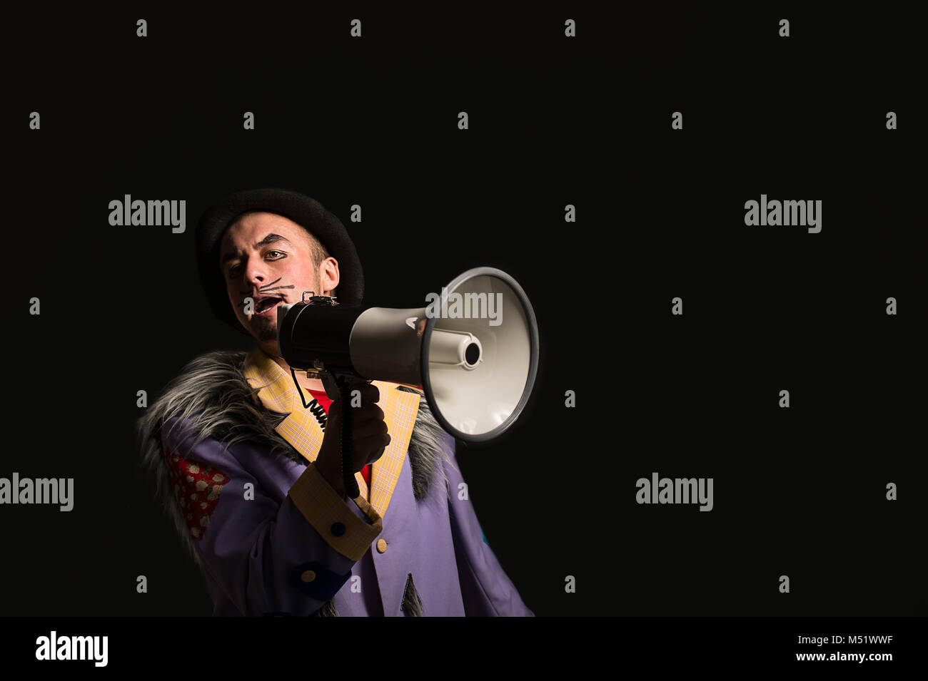 Clown shouting at the megaphone Stock Photo - Alamy