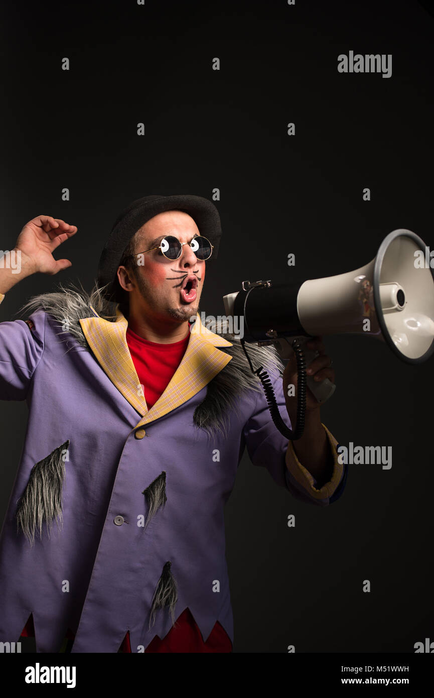 Clown shouting at the megaphone Stock Photo - Alamy