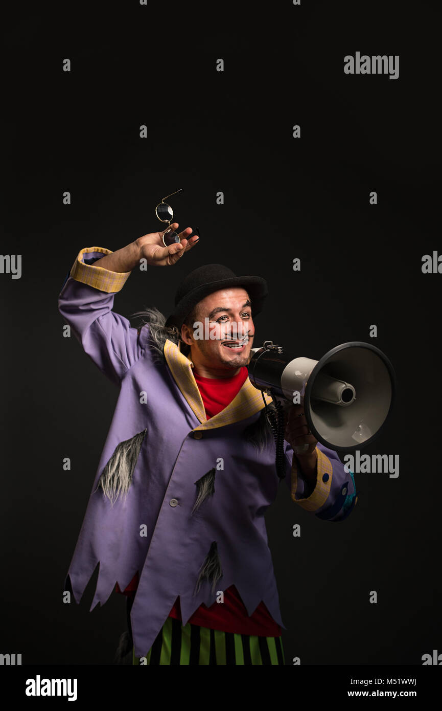 Clown shouting at the megaphone Stock Photo - Alamy