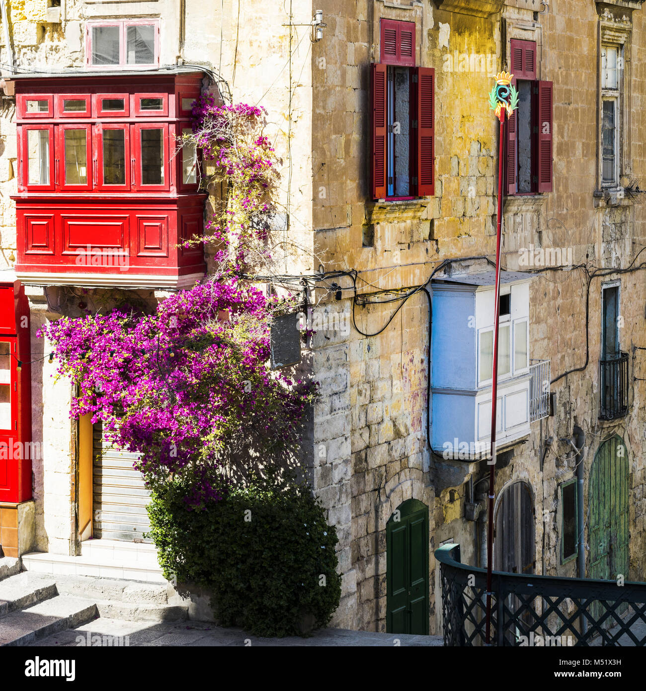 Building with traditional colorful maltese balcony Stock Photo - Alamy