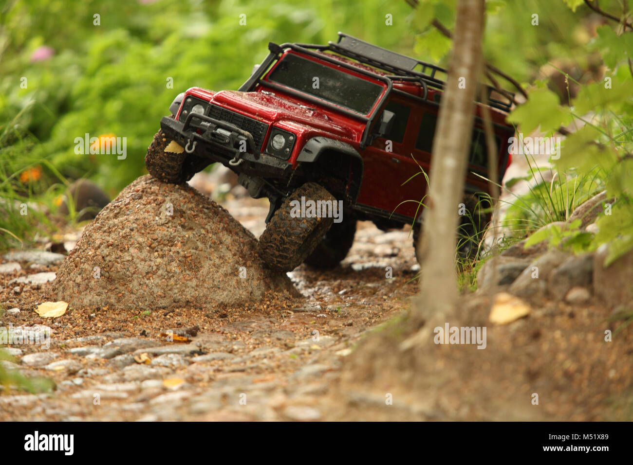Off-road vehicle go around obstacles Stock Photo - Alamy