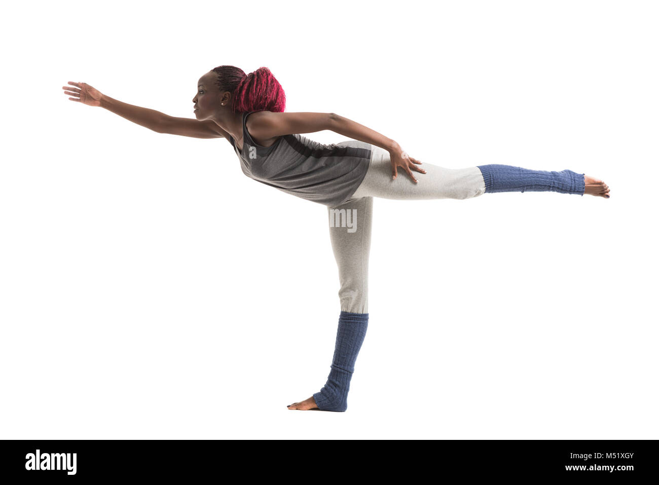 Woman balancing while doing yoga isolated on white background Stock ...