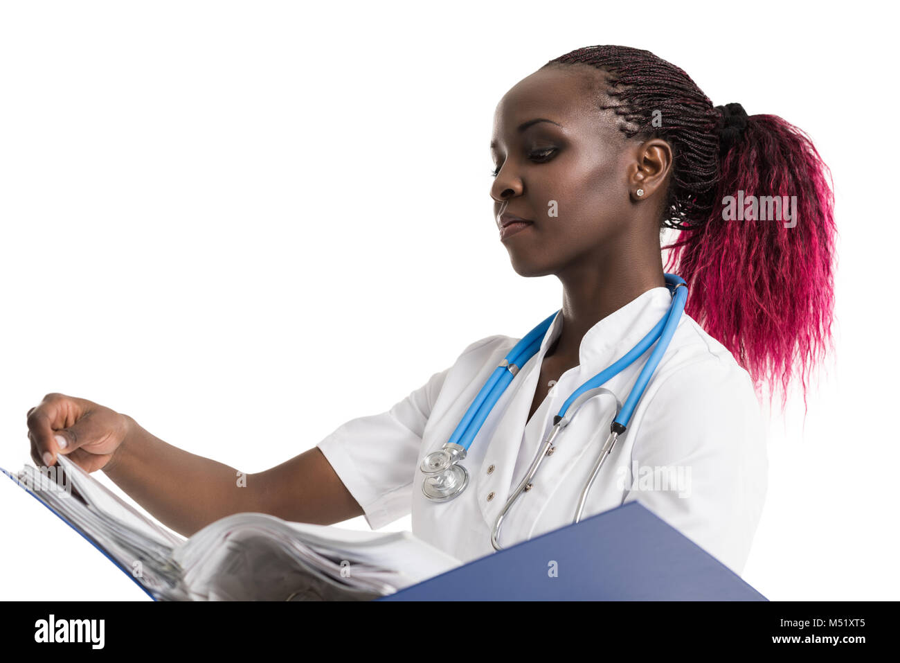 Portrait of confident young medical doctor holding medical records on ...