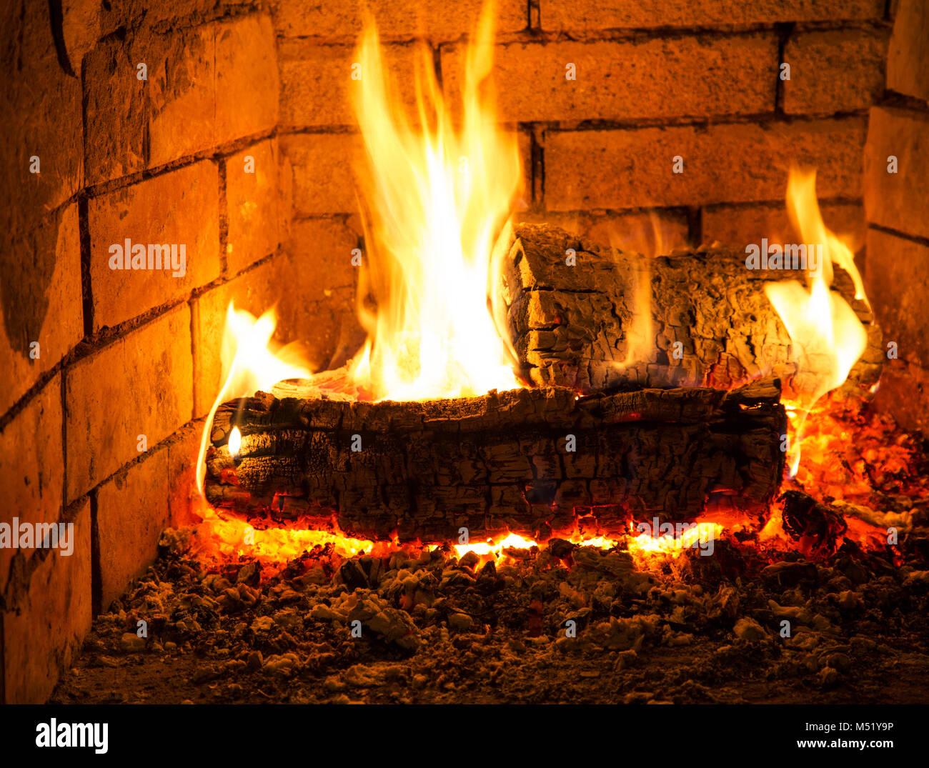 Burning fire wood in a fireplace Stock Photo - Alamy