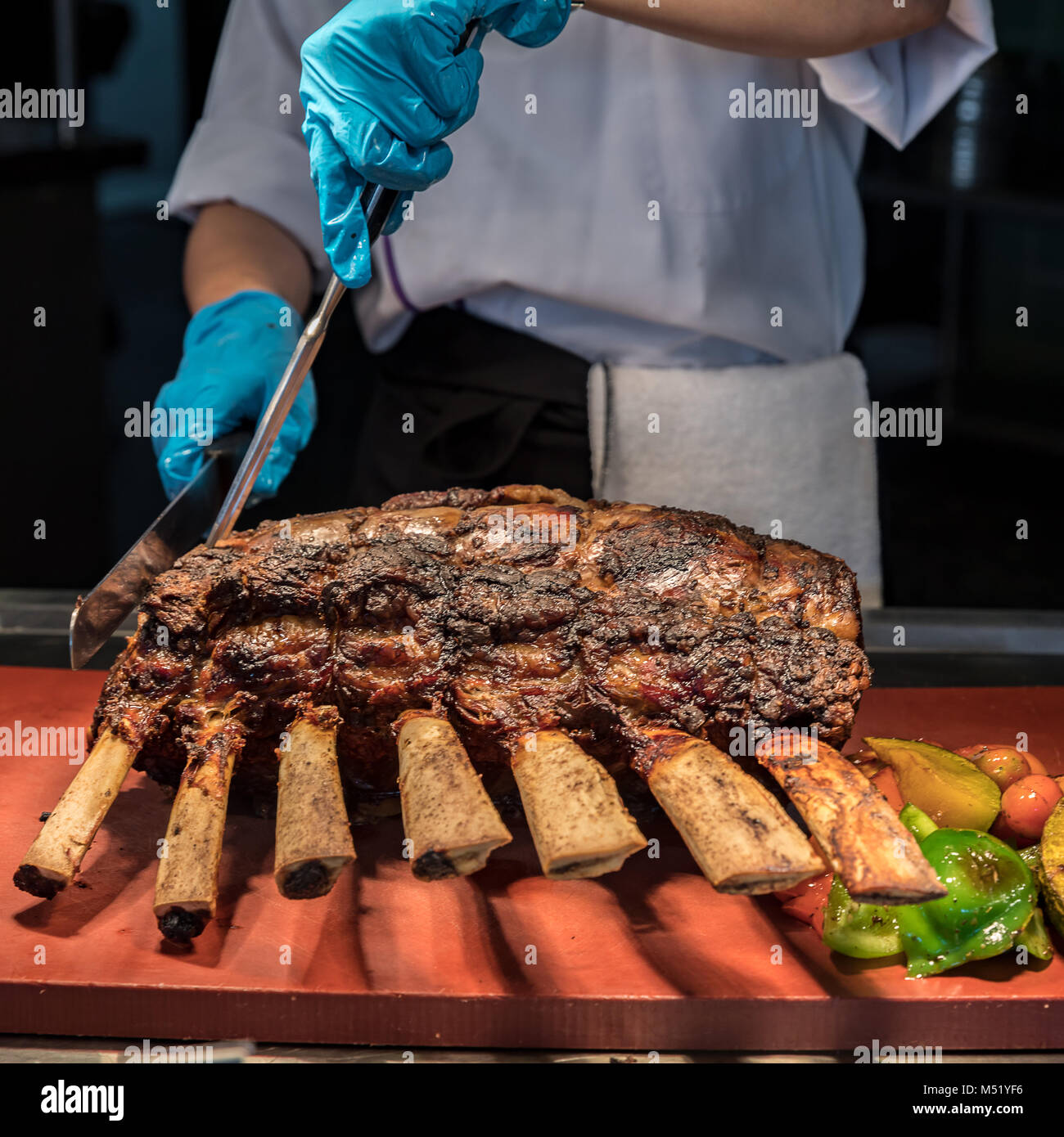 Chef carving beef Stock Photo - Alamy