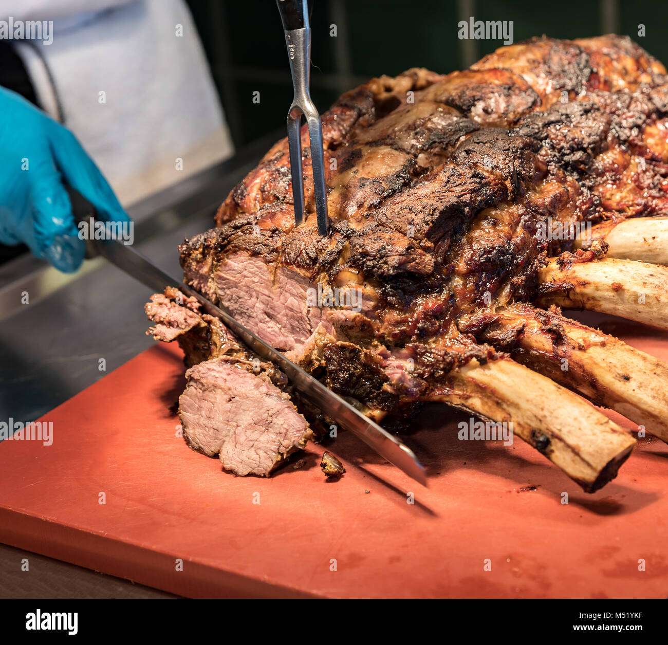 Chef carving beef Stock Photo - Alamy
