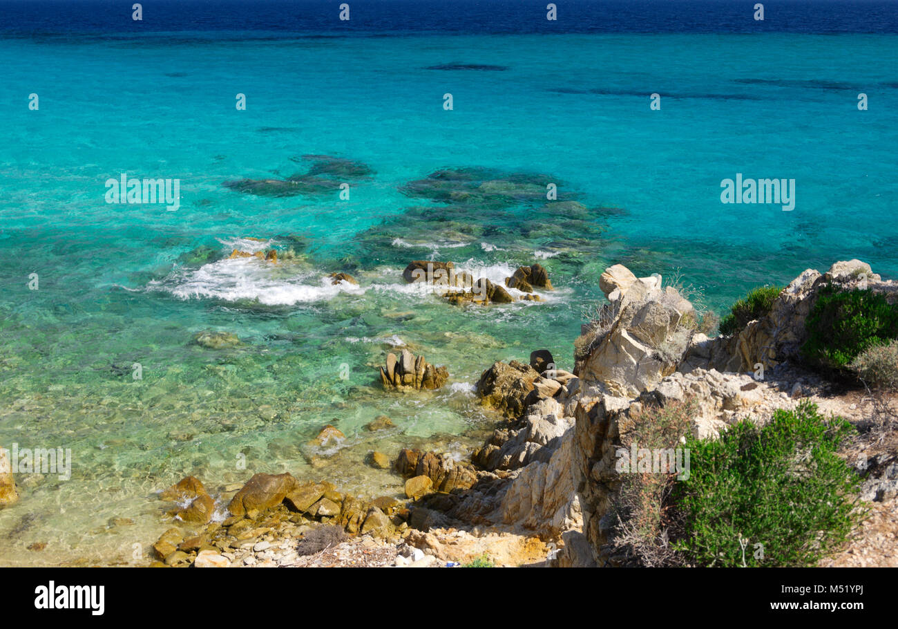 Blue sea shore under clear sky Stock Photo - Alamy