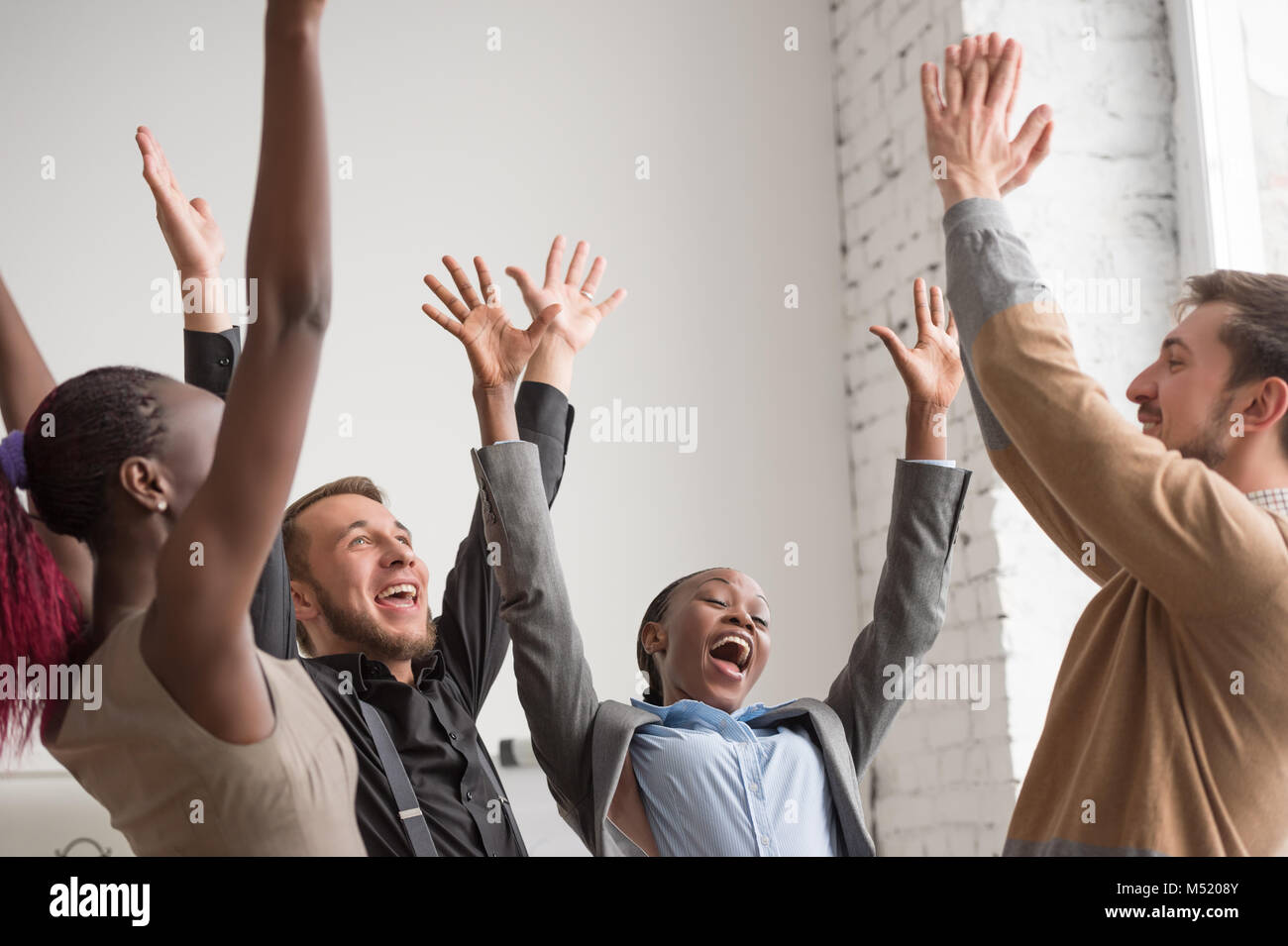 Business team celebrating a good job in the office Stock Photo - Alamy