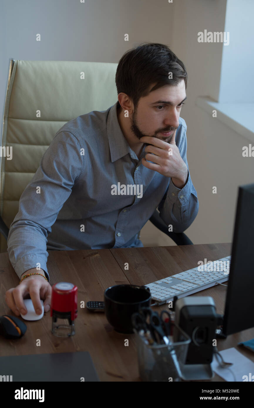 Handsome businessman working with computer in office Stock Photo - Alamy