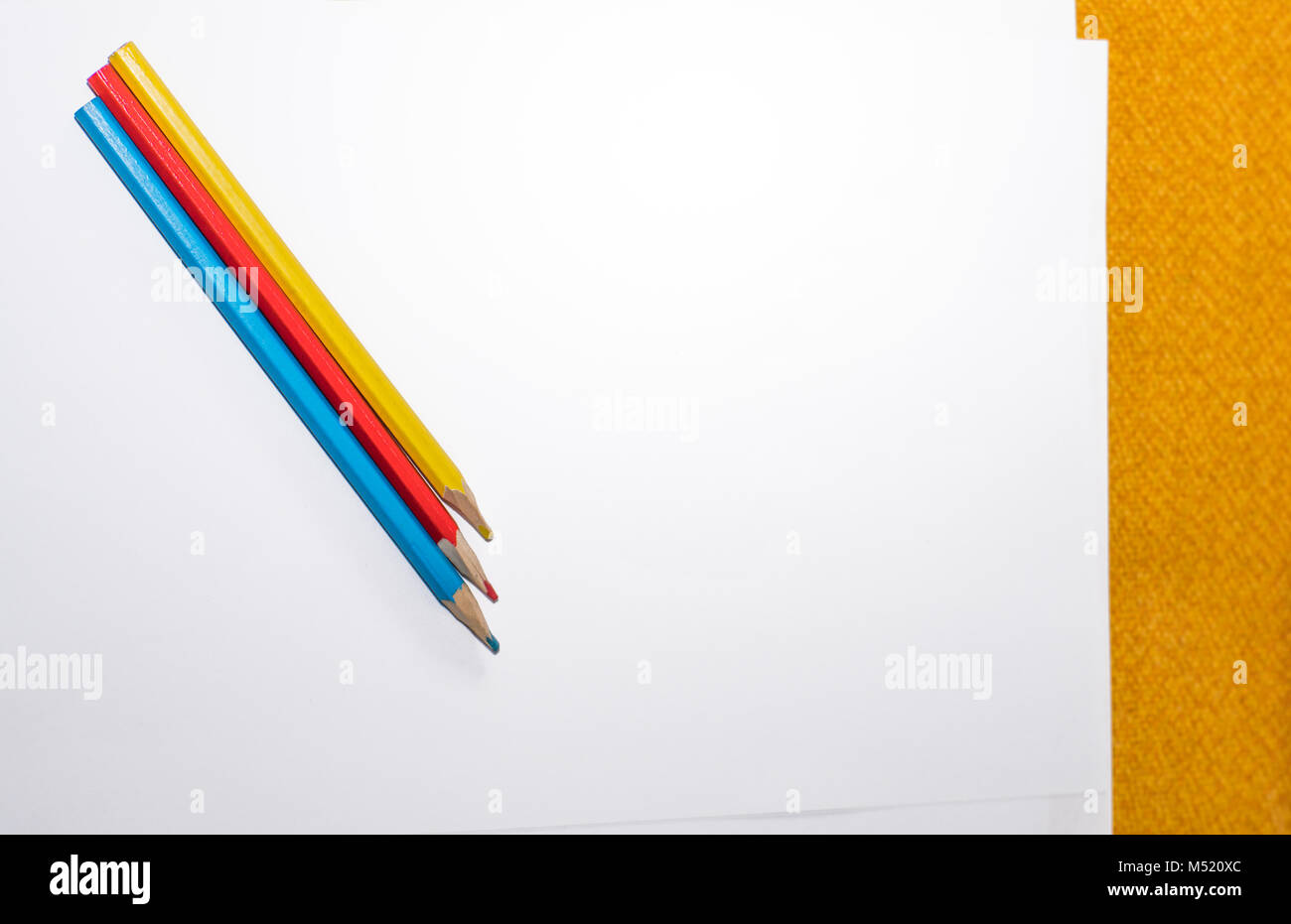 Colorful crayons on white paper Stock Photo - Alamy