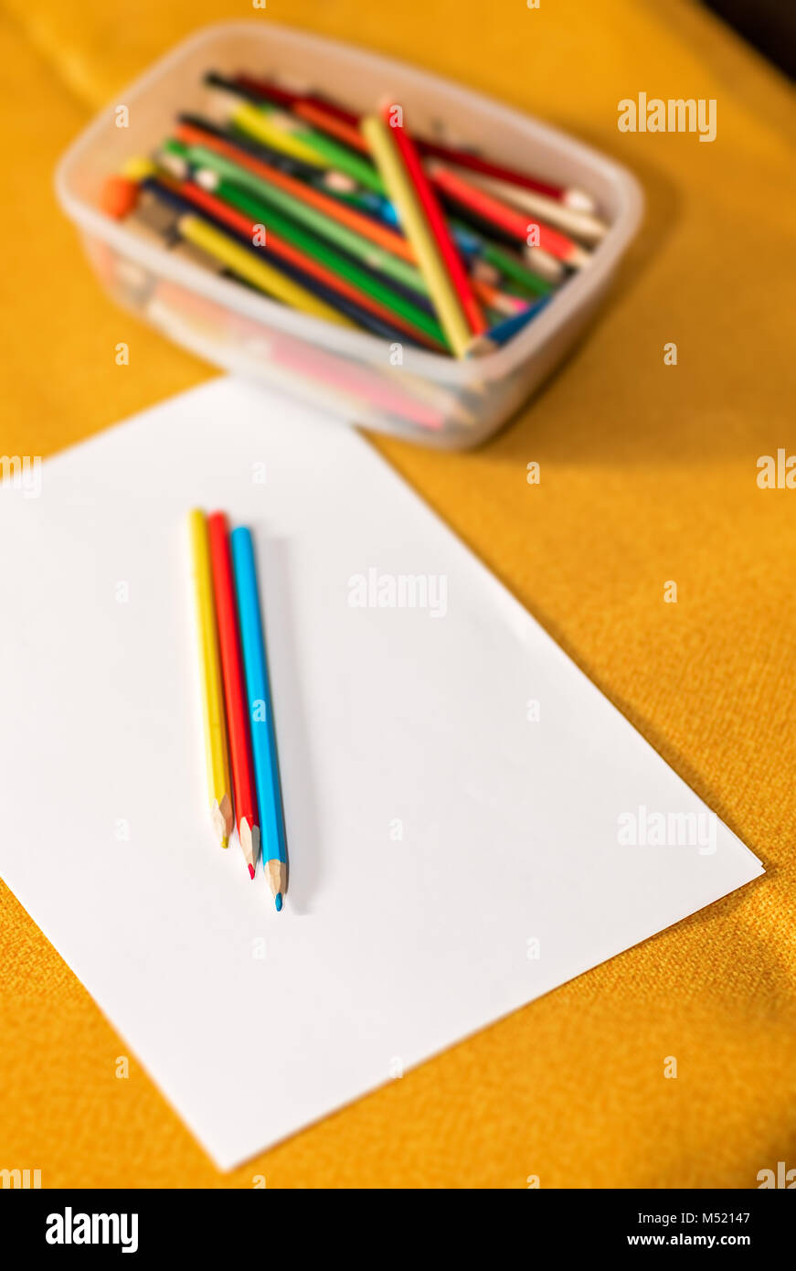 Colorful crayons on white paper Stock Photo - Alamy