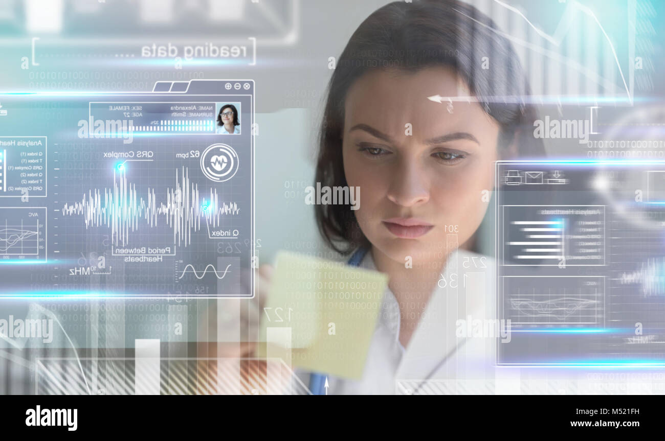 Medical doctor writing patient test results on transparent board to ...