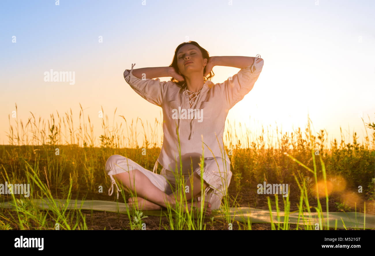 Stretching woman in outdoor exercise smiling happy doing yoga stretches ...