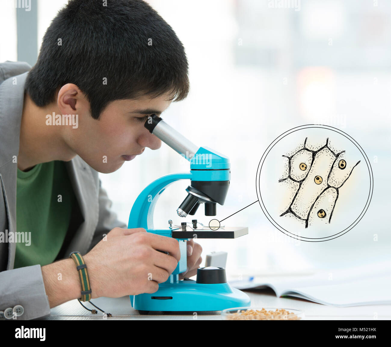 High School students. Young handsome male student looking through ...