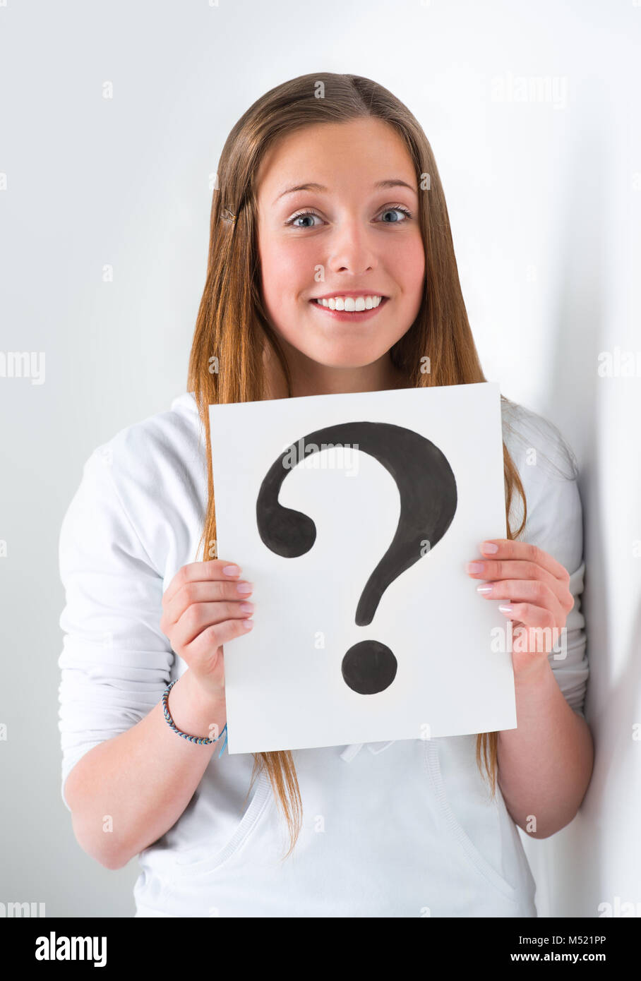 Portrait of happy student with question mark sign at campus Stock Photo ...