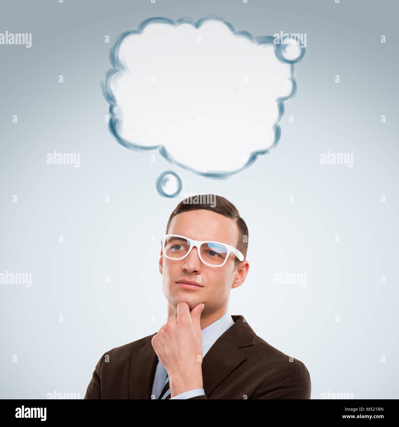 Image of young man thinking of his plans. Lots of copyspace inside ...