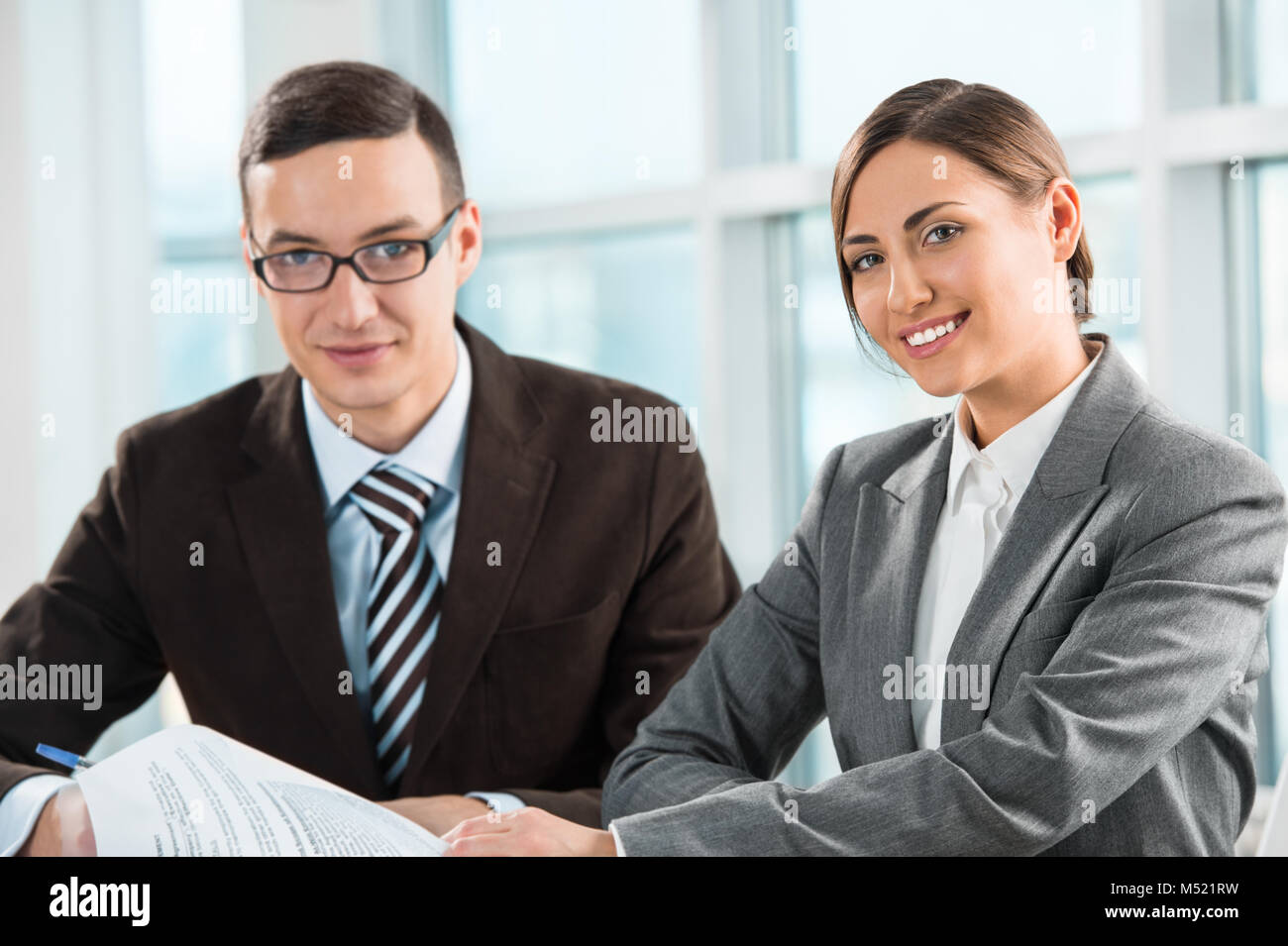 Business meeting in an office - two business people man and woman ...