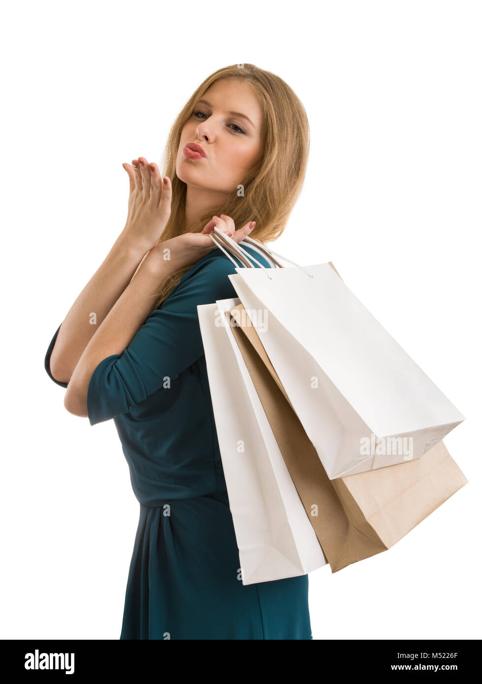 Portrait of young happy sending air kiss woman with shopping bags ...