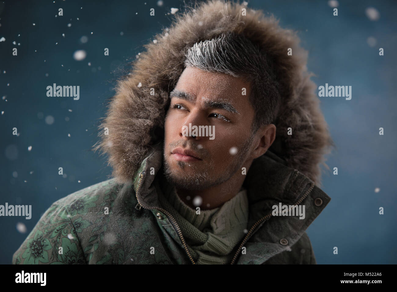 Male model posing in snow hi-res stock photography and images - Alamy