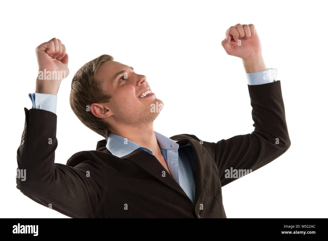 An excited young executive celebrating the success of his business ...