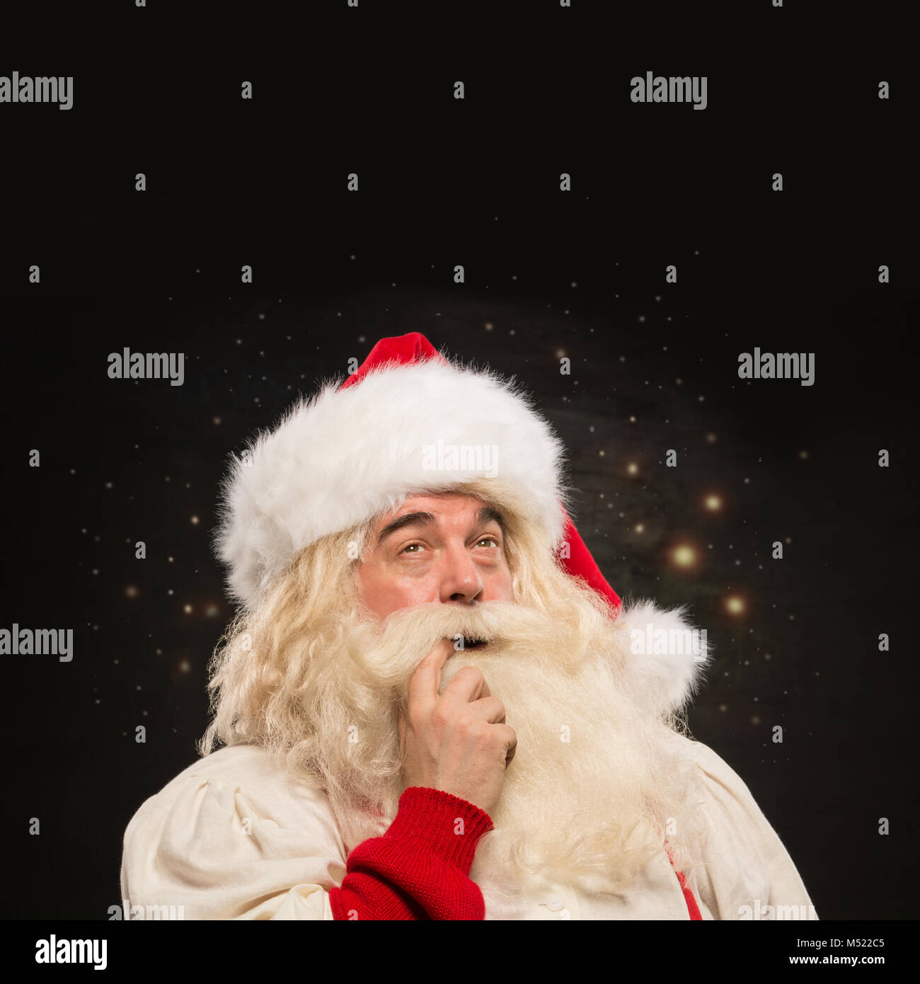 Santa Claus at night making magic Stock Photo - Alamy