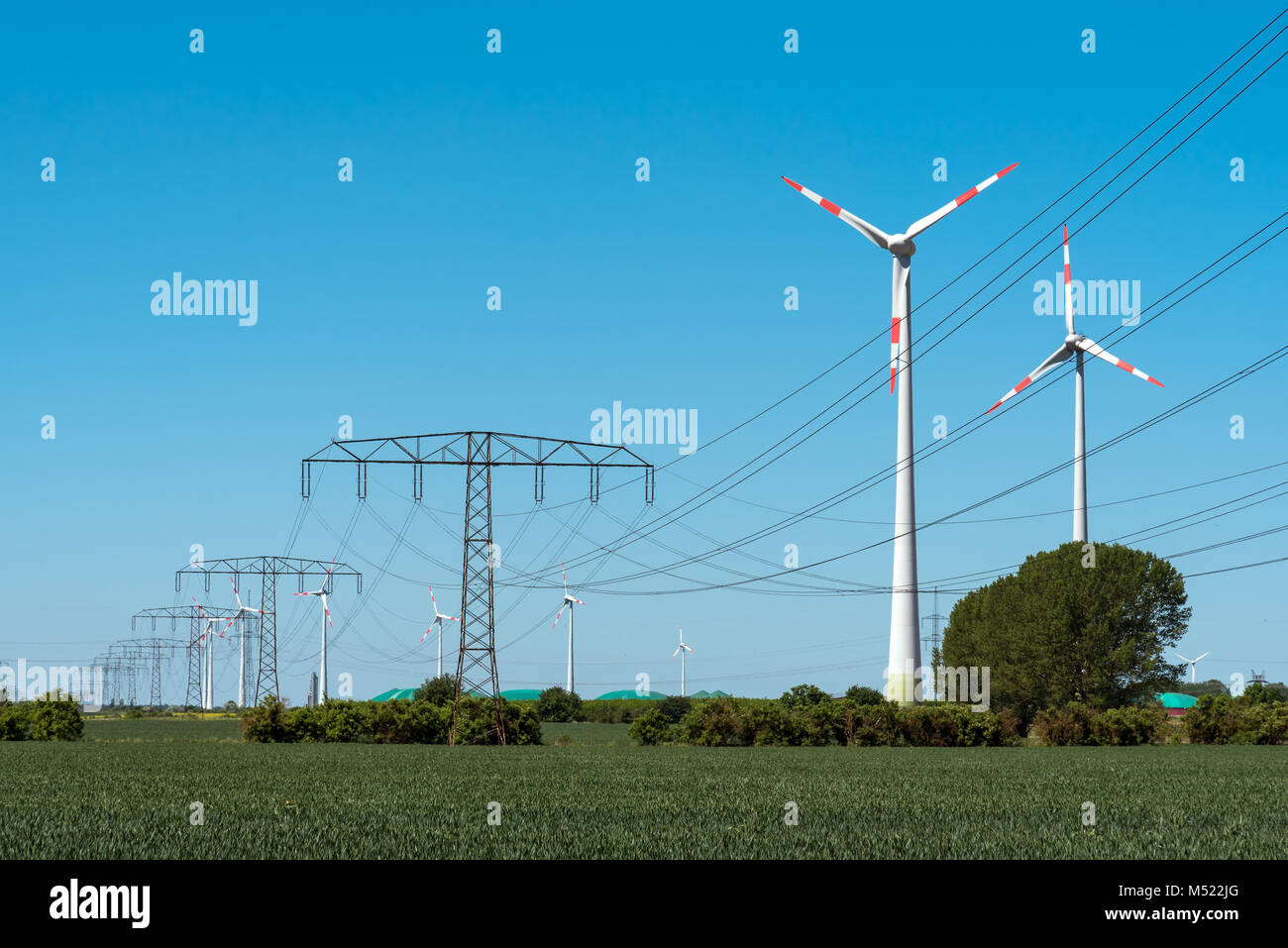 Windwheels and power transmission lines seen in rural Germany Stock ...