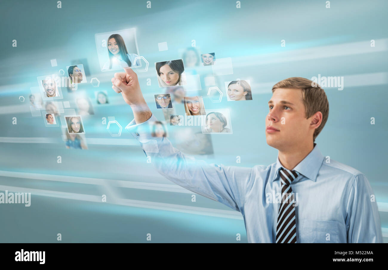 Portrait of young businessman choosing people for his business team ...