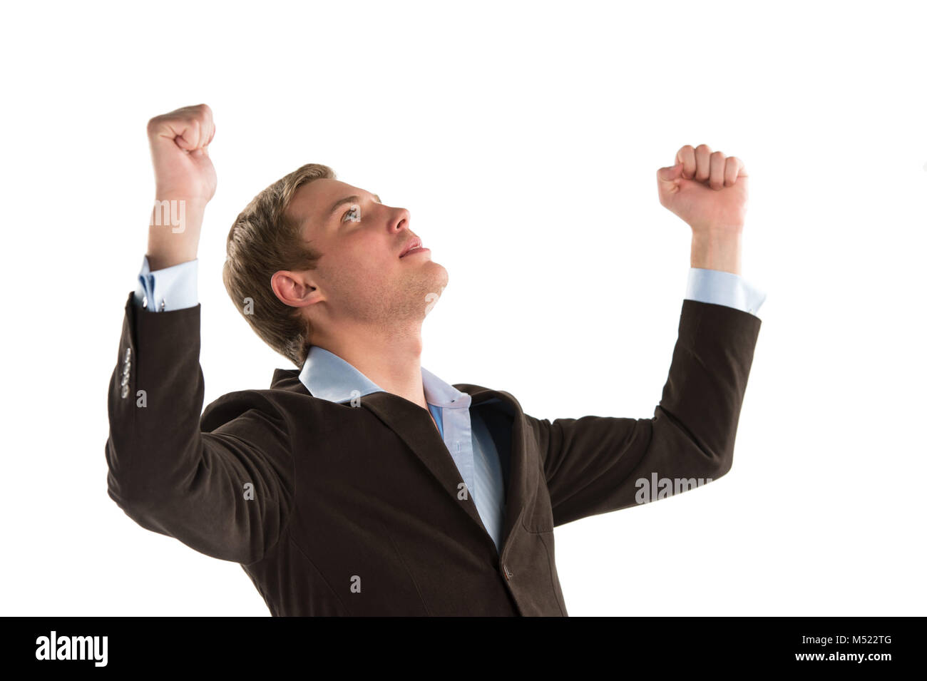An excited young executive celebrating the success of his business ...