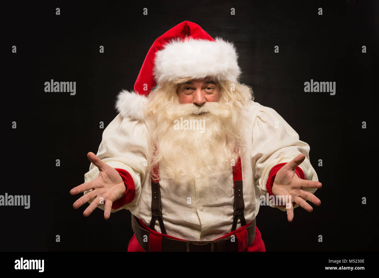 Santa Claus portrait expressing gesturing and presenting something ...