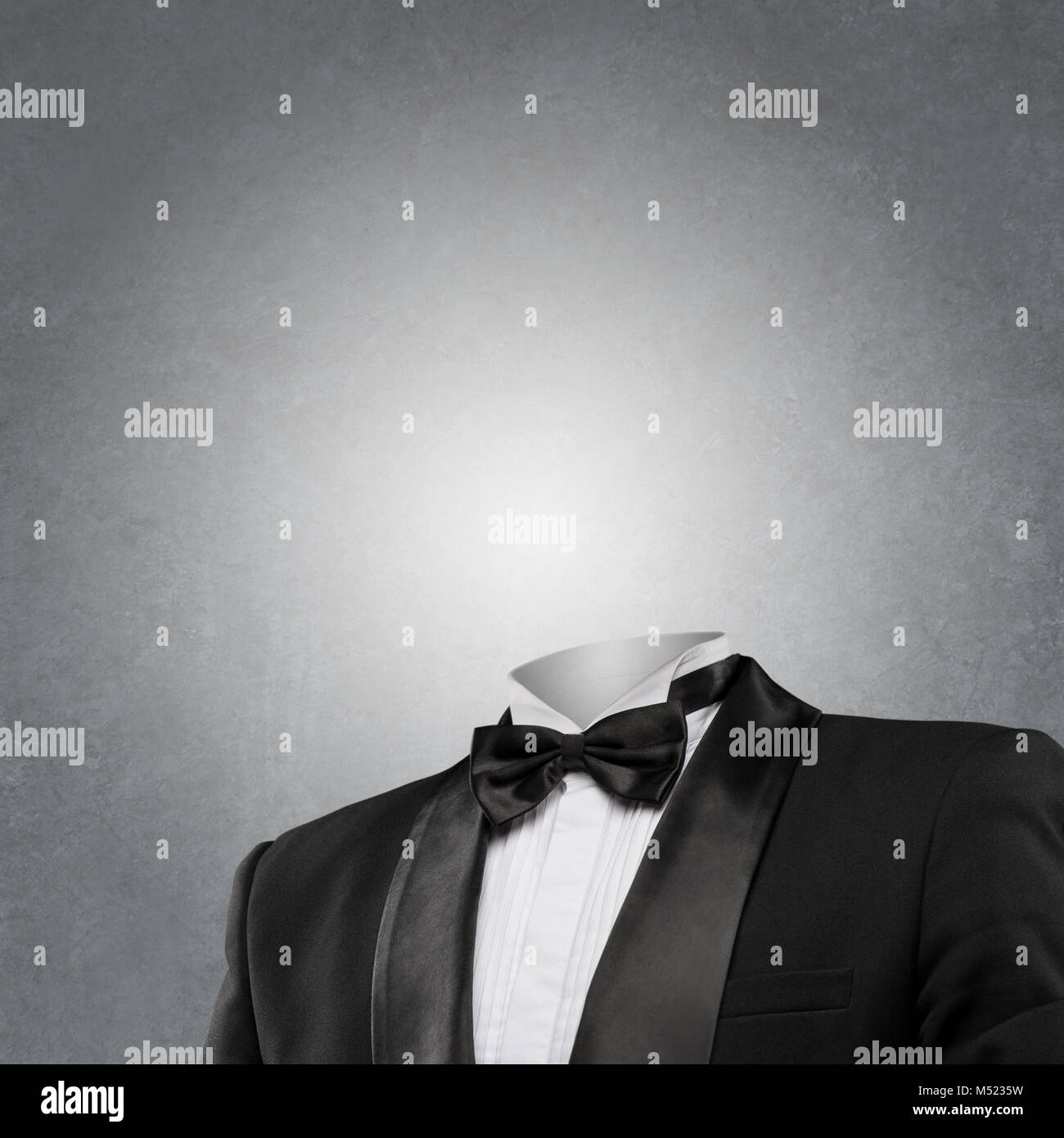 Man without head on dark concrete background Stock Photo - Alamy