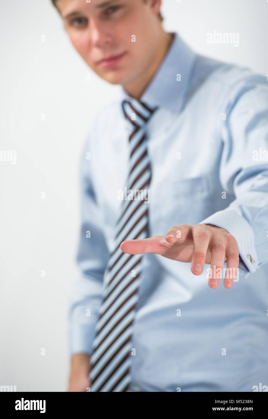 Young positive business man touching virtual button. Editable image ...