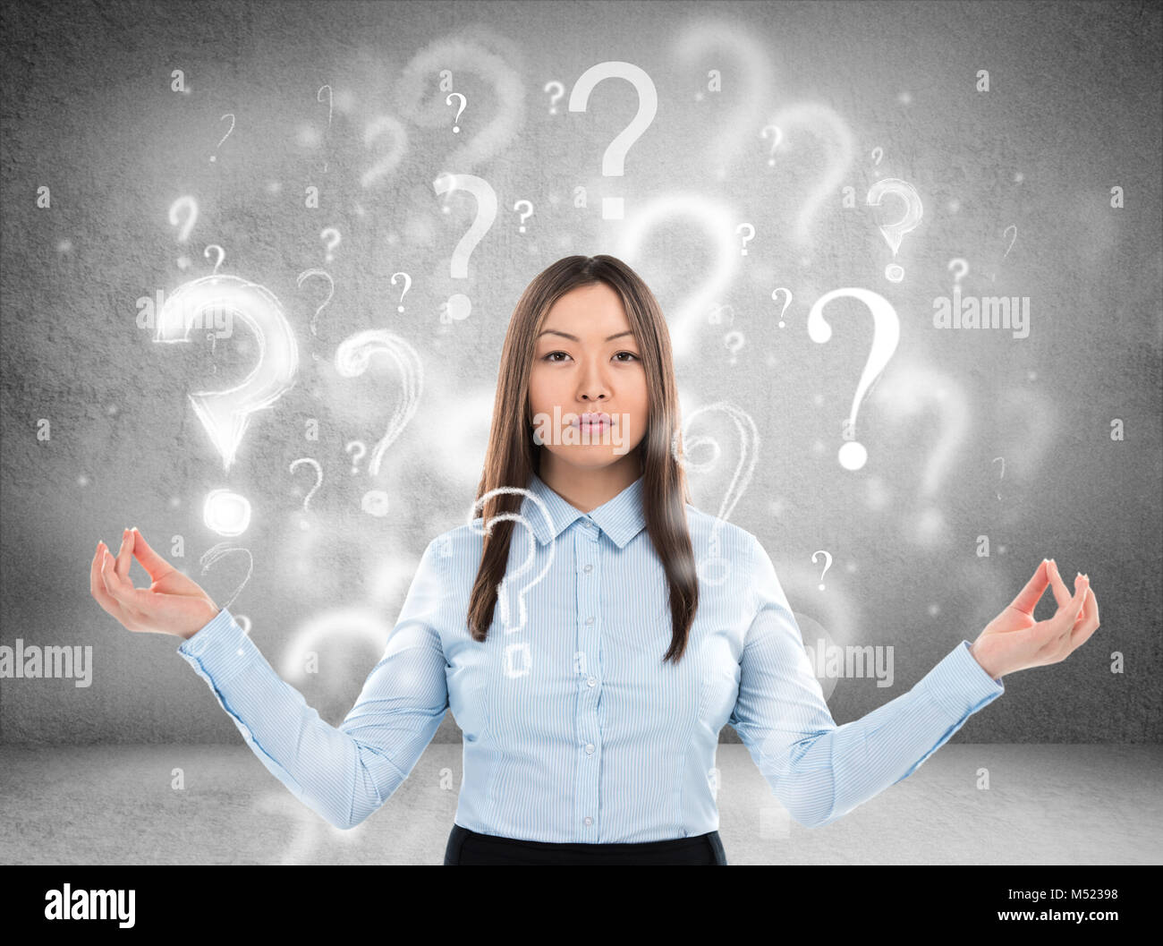 Beautiful business woman with question marks above her head Stock Photo ...