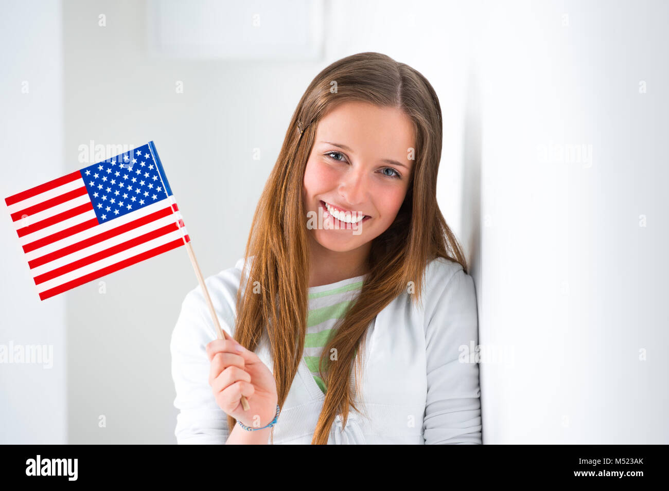 Portrait of a lovely young woman with United State's flag smiling Stock ...