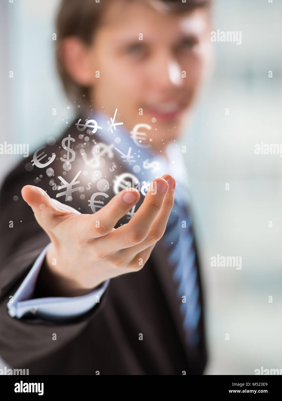 Investment concept. Handsome business man with currency symbols Stock ...