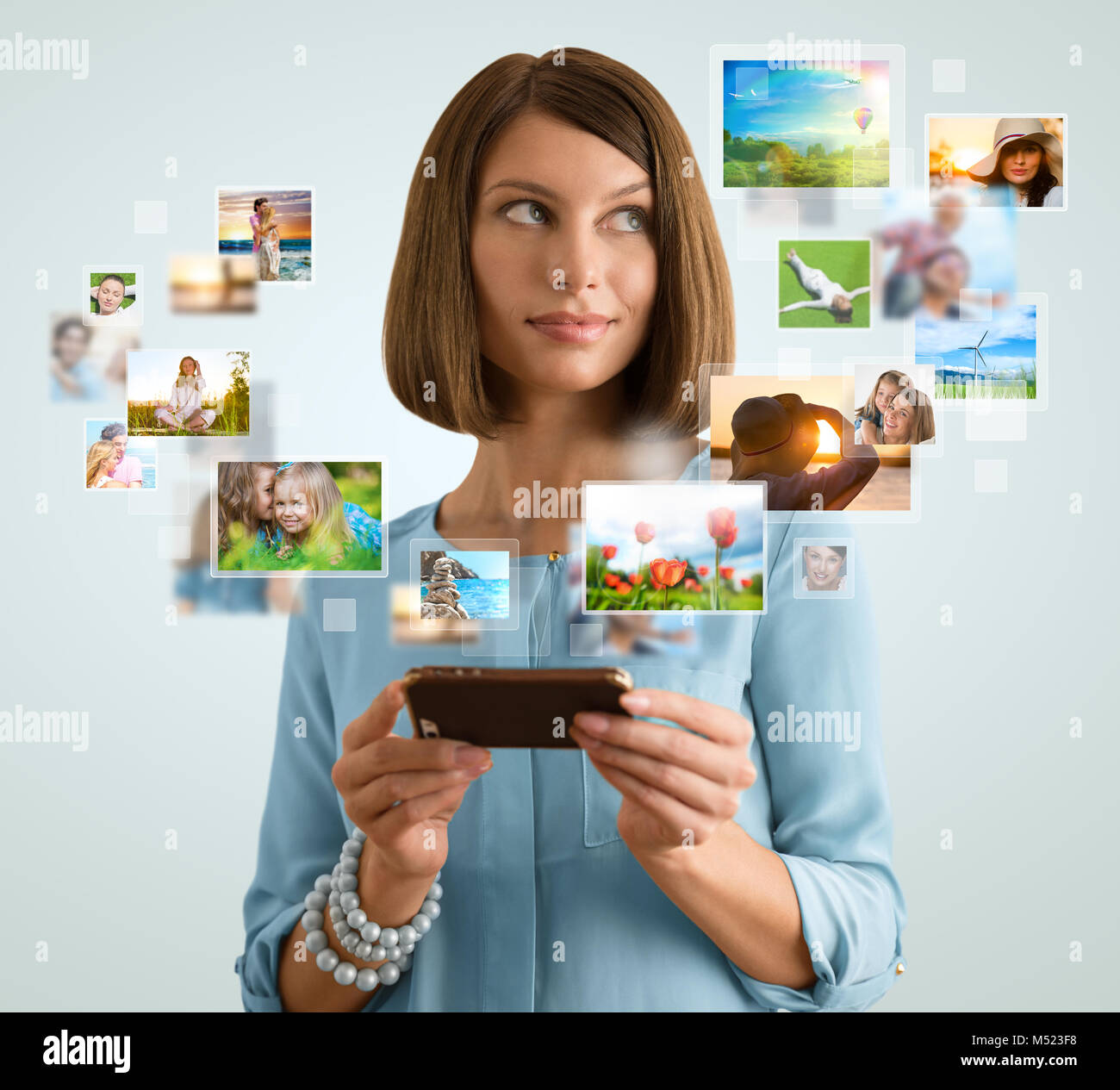 Portrait of young happy woman sharing her photo and video files in ...