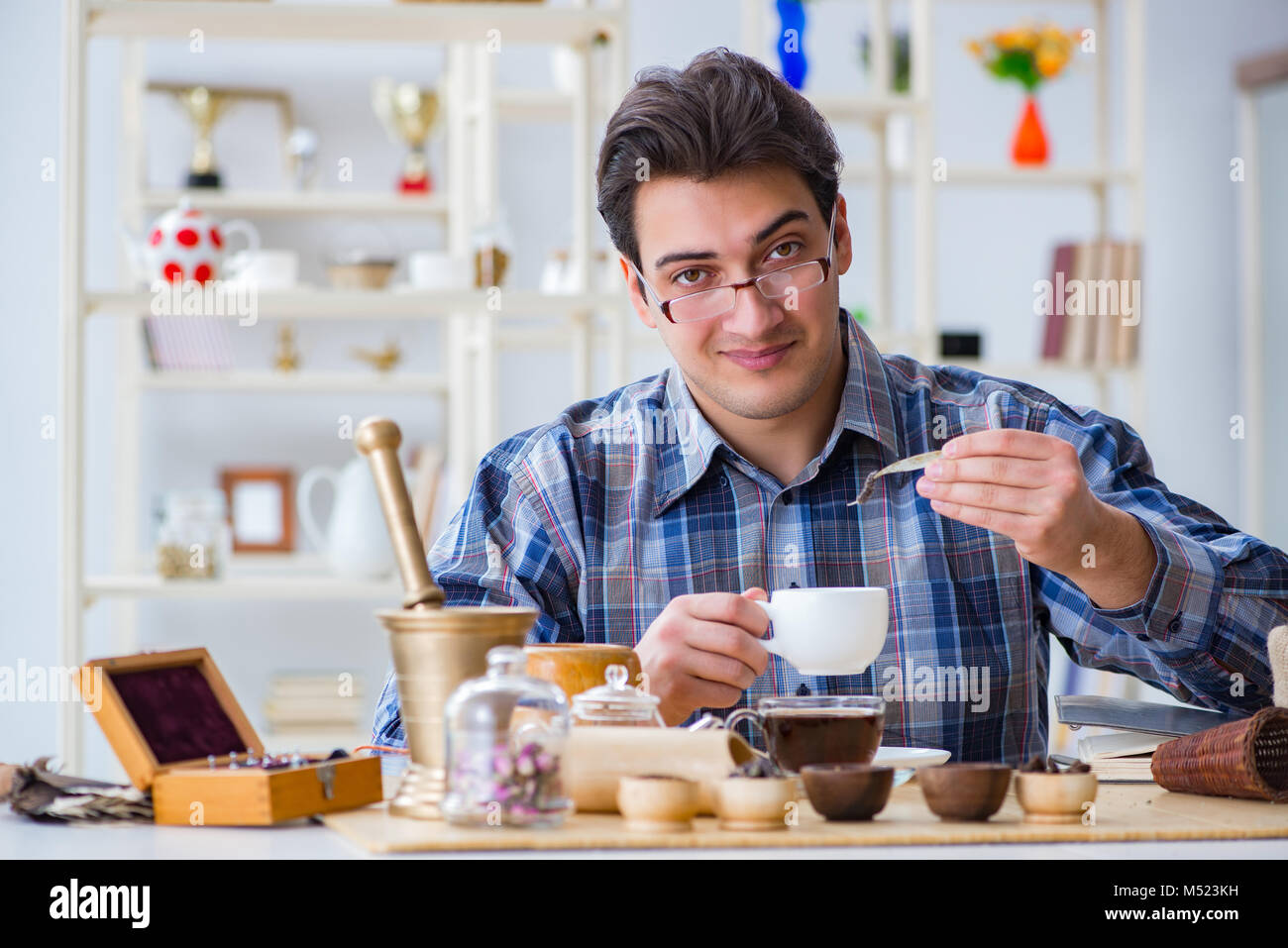 The professional tea expert trying new brews Stock Photo - Alamy