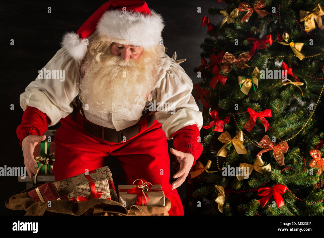 Opening gifts secret santa hi-res stock photography and images - Alamy